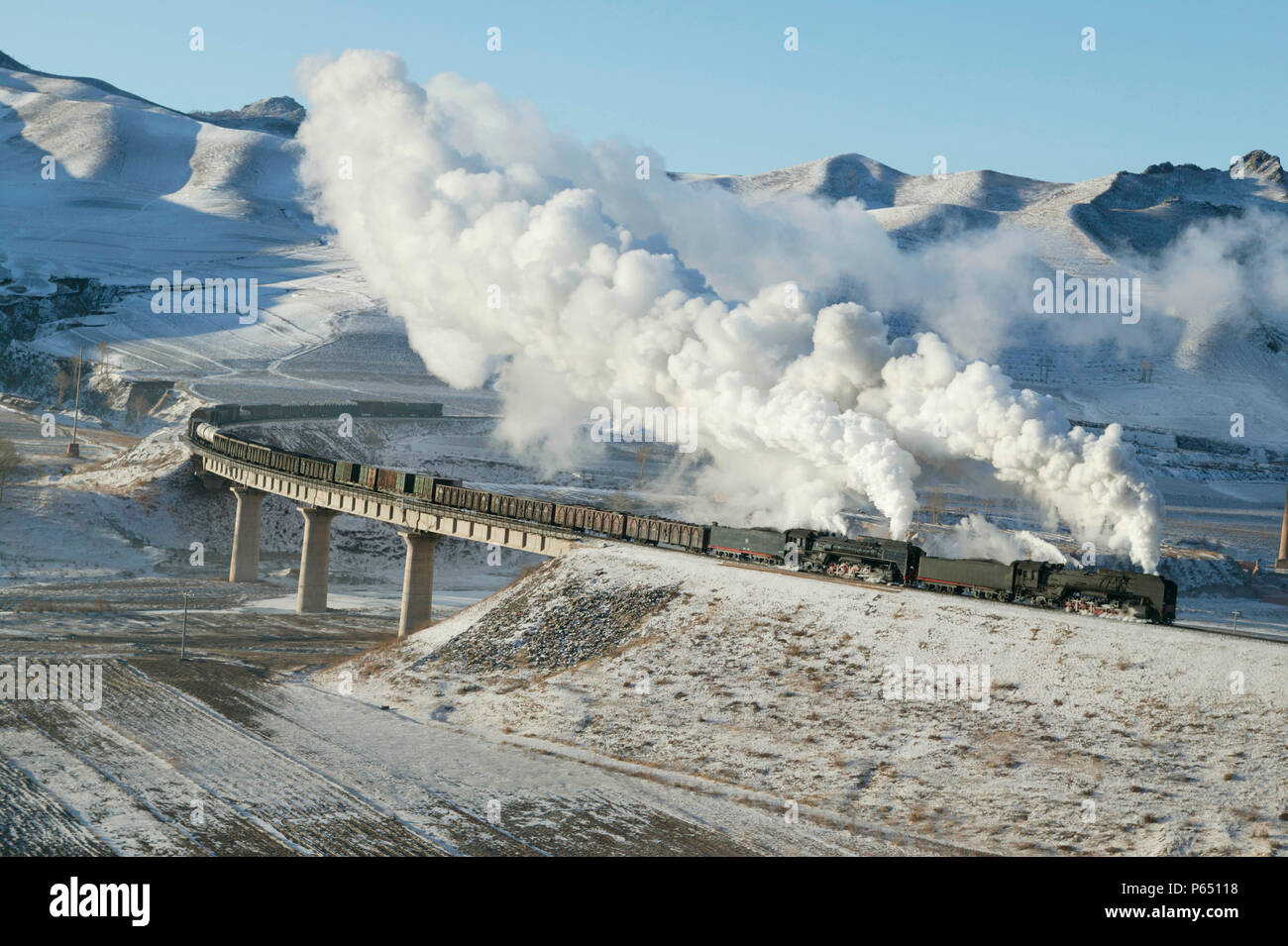 A east bound freight heads along the Jing Peng pass section of the Ji ...