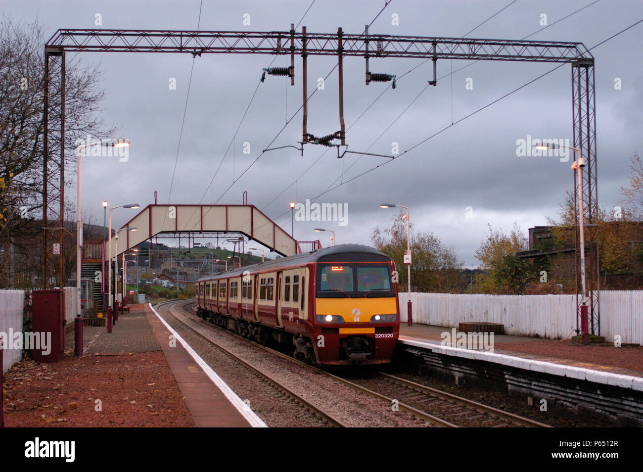 A First ScotRail train number 320.320 calls at Bowling with an Airdrie ...