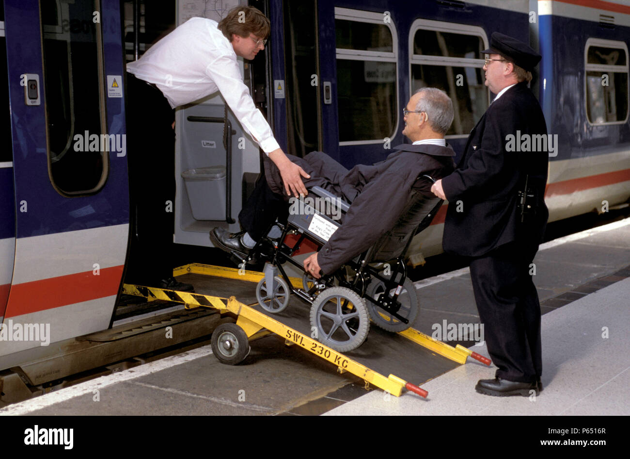 Staff helping disabled passenger hi-res stock photography and images ...