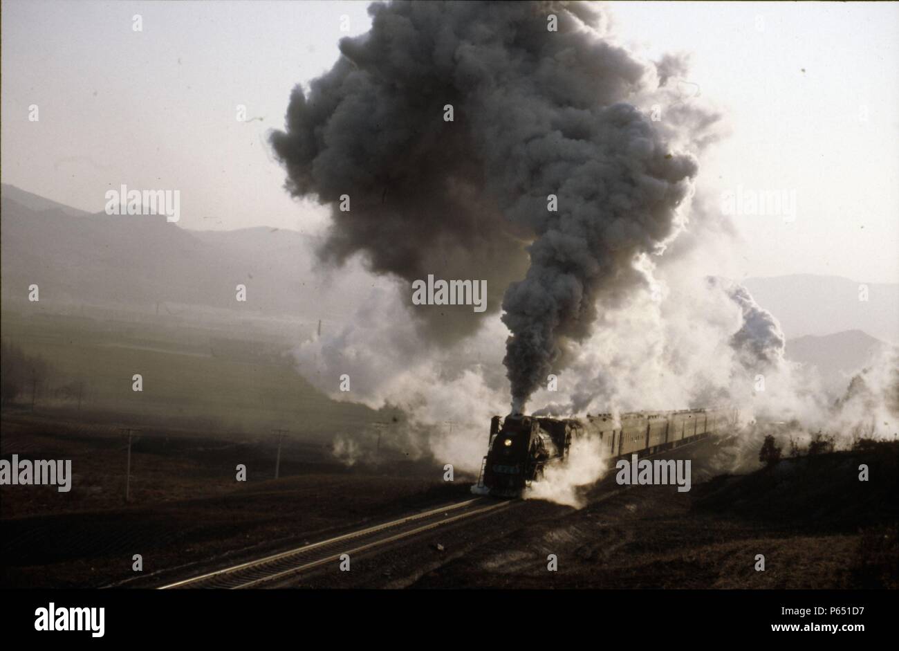 A northbound passenger train nears the summit of Nancha Bank behind a ...