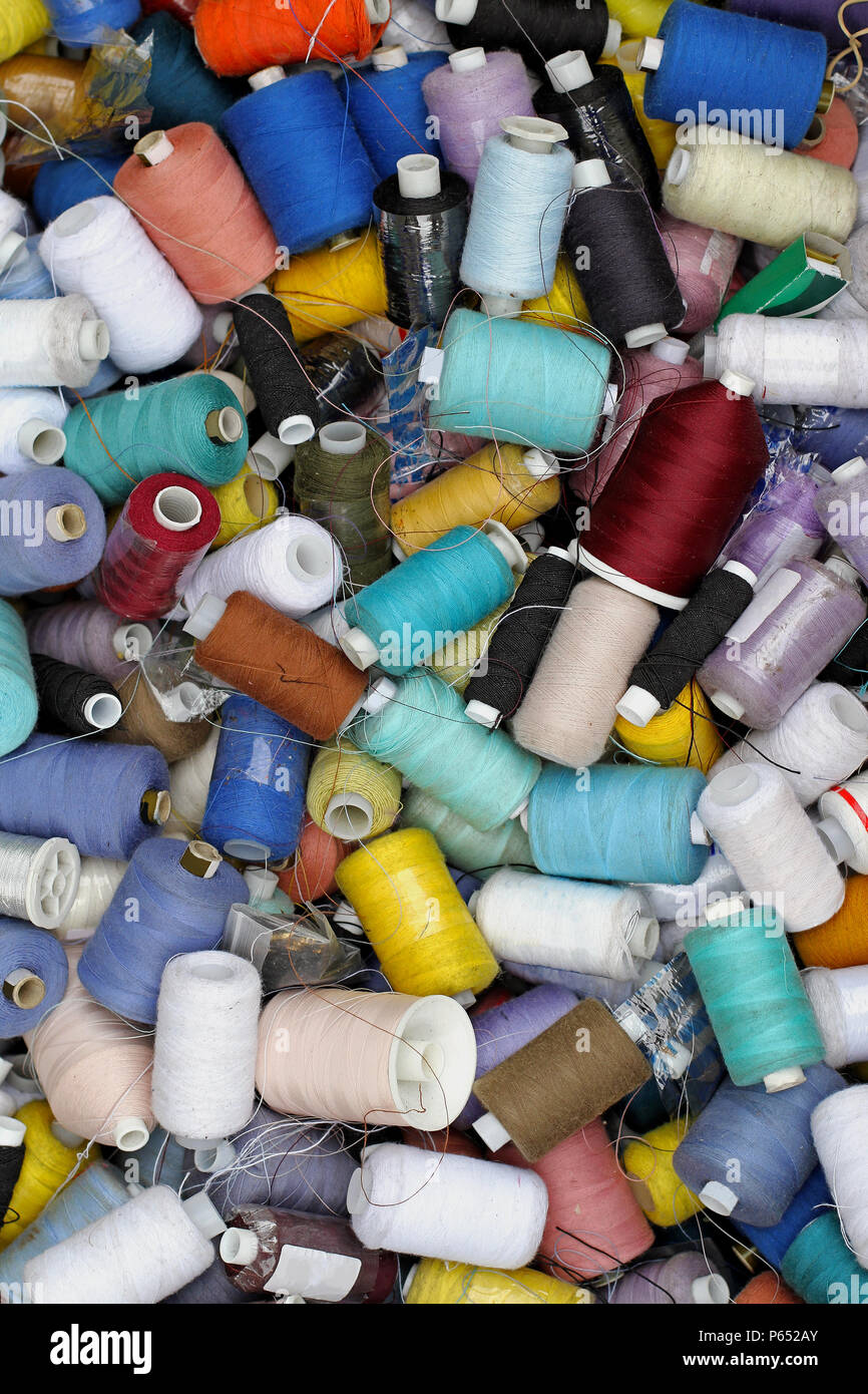 Bunch of thread spools in various color Stock Photo - Alamy
