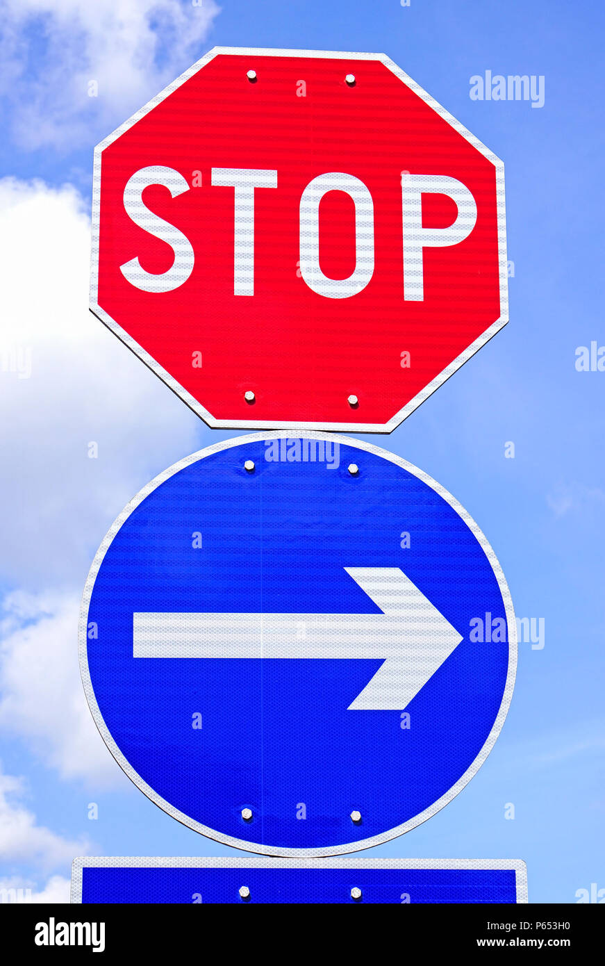 Stop sign and arrow traffic sign Stock Photo - Alamy