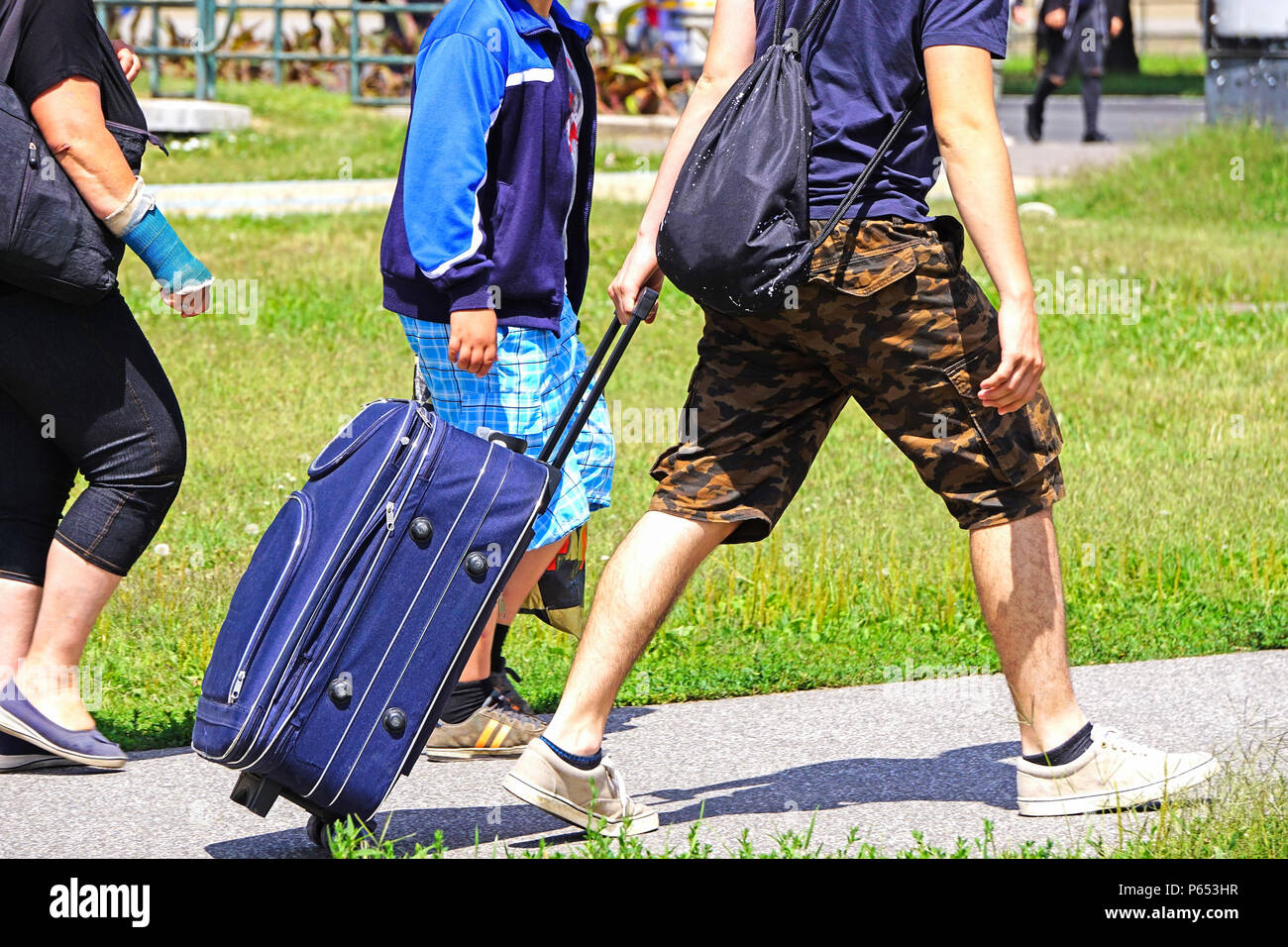 Young people pull suitcase hi-res stock photography and images - Alamy