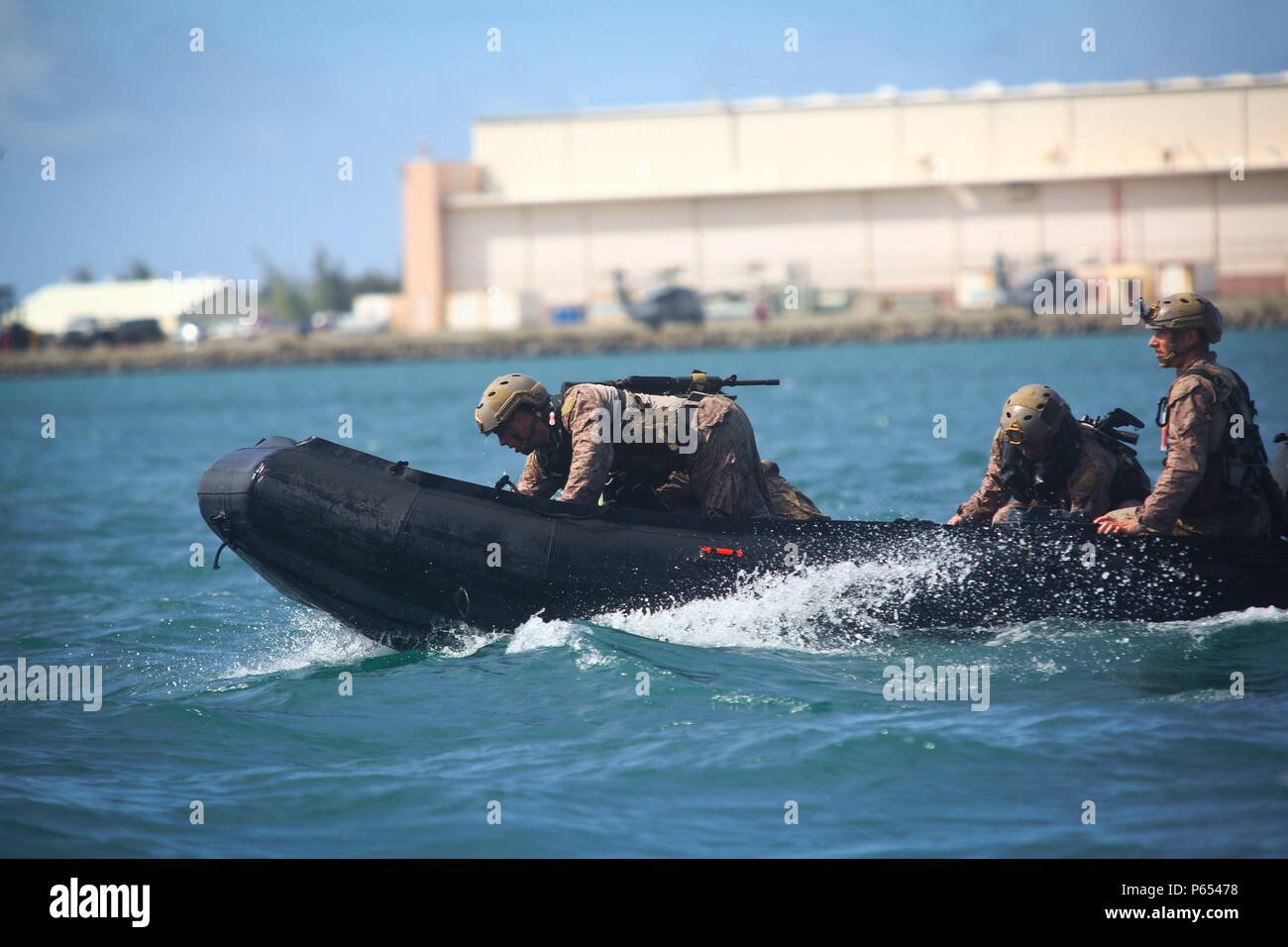 U.S. Reconnaissance Marines ride a combat rubber raiding craft during ...