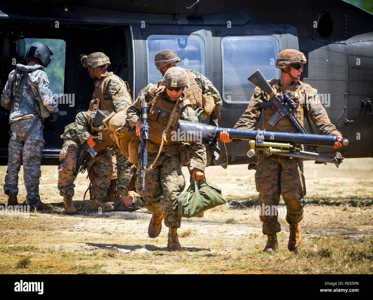 U.S. Marines assigned to 3rd Battalion, 3rd Marine Regiment disembark ...