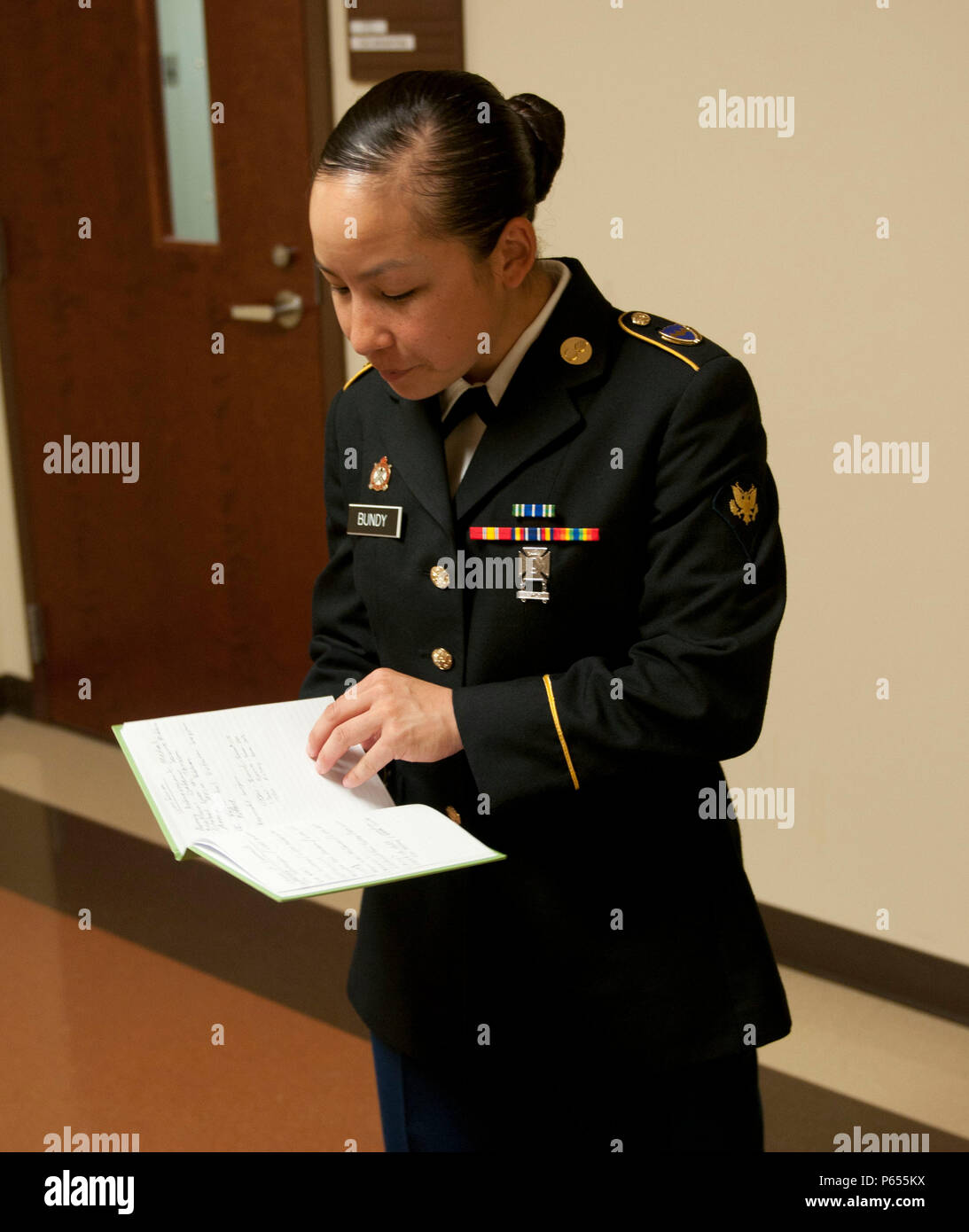 Spc. Kayla Bundy a Wheeled Vehicle Mechanic scans her study notes prior ...