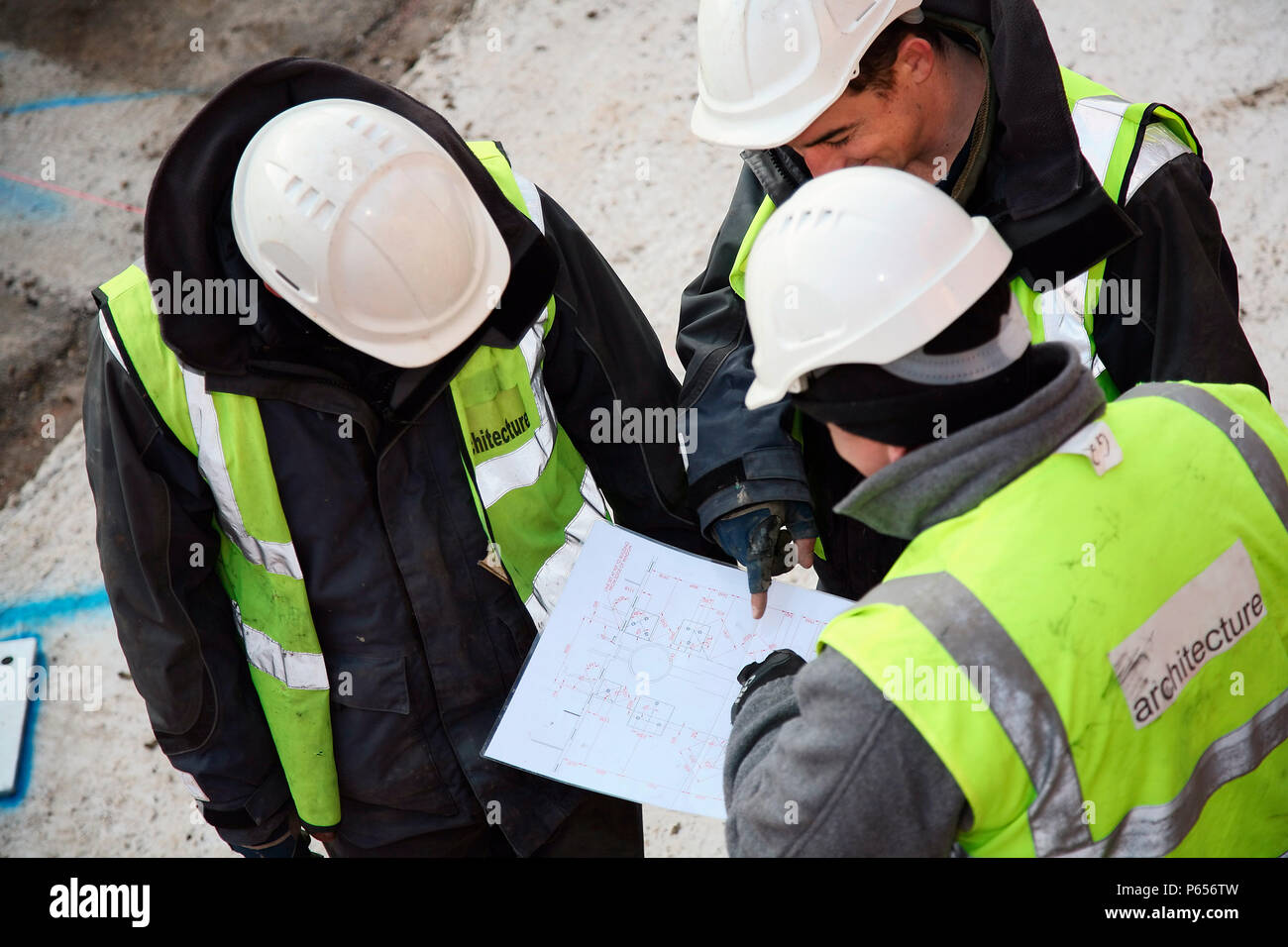 Construction workers discussing plans Stock Photo - Alamy