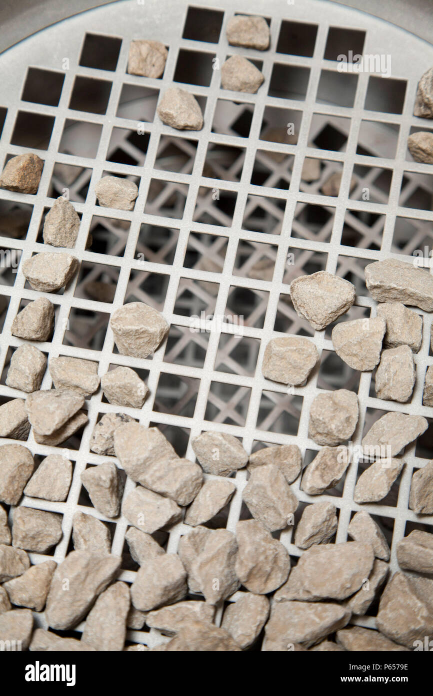 Sieves showing the different size materials from a test sample ...