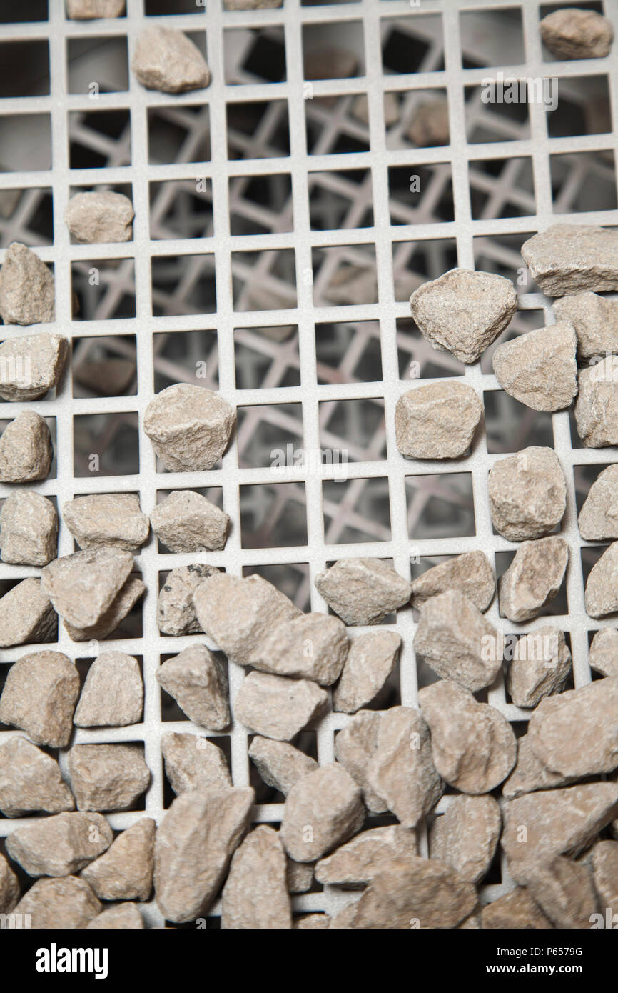 Sieves showing the different size materials from a test sample ...