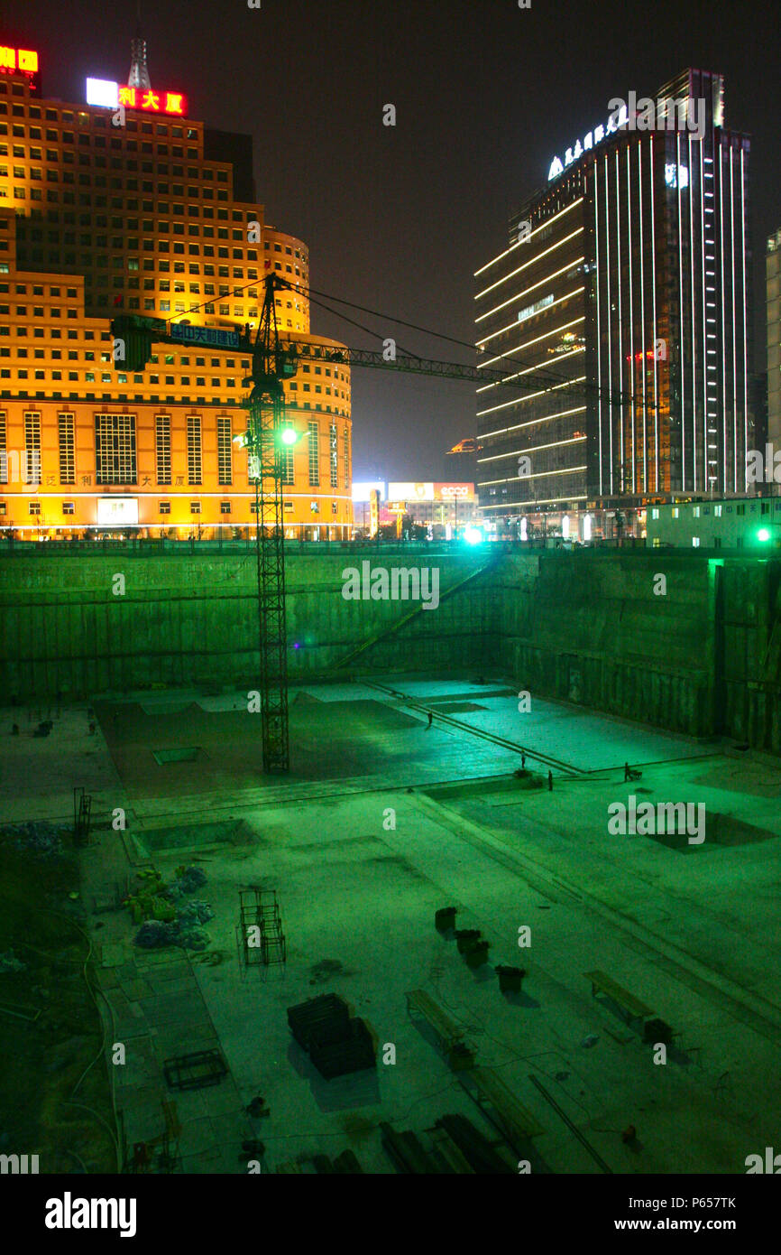 Flood lit foundations at a construction site in central Beijing Stock ...