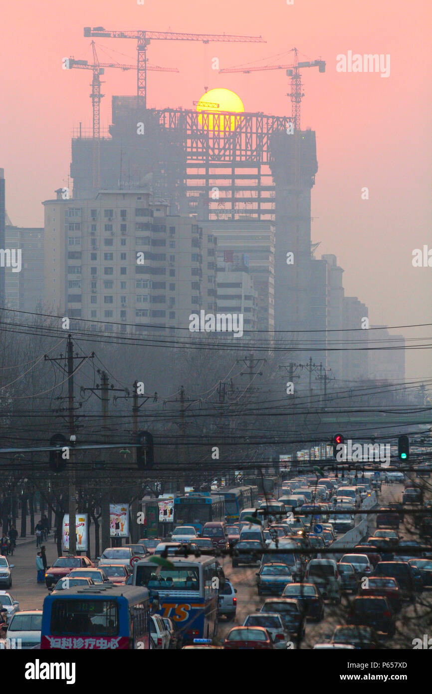 The sun sets behind the New Polly Plaza under construction at ...