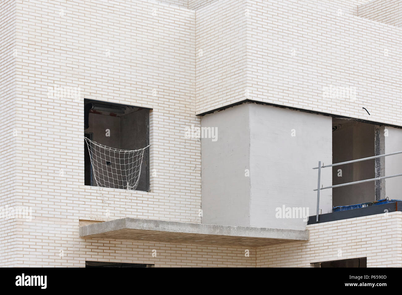 Building facade under construction. Brick wall structure. Horizontal ...