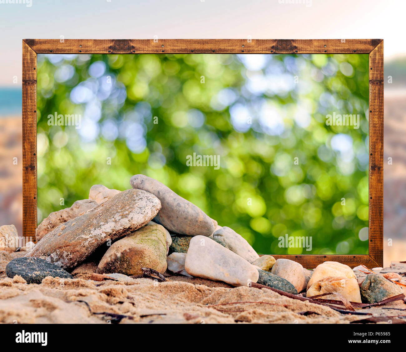 Rock on the beach with beautiful green city rainy bush picture frame ...