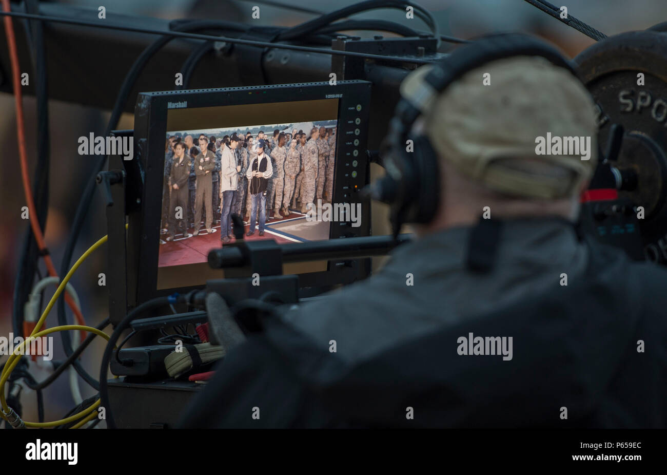 A television crew member from ABC’s Good Morning America prepares for ...