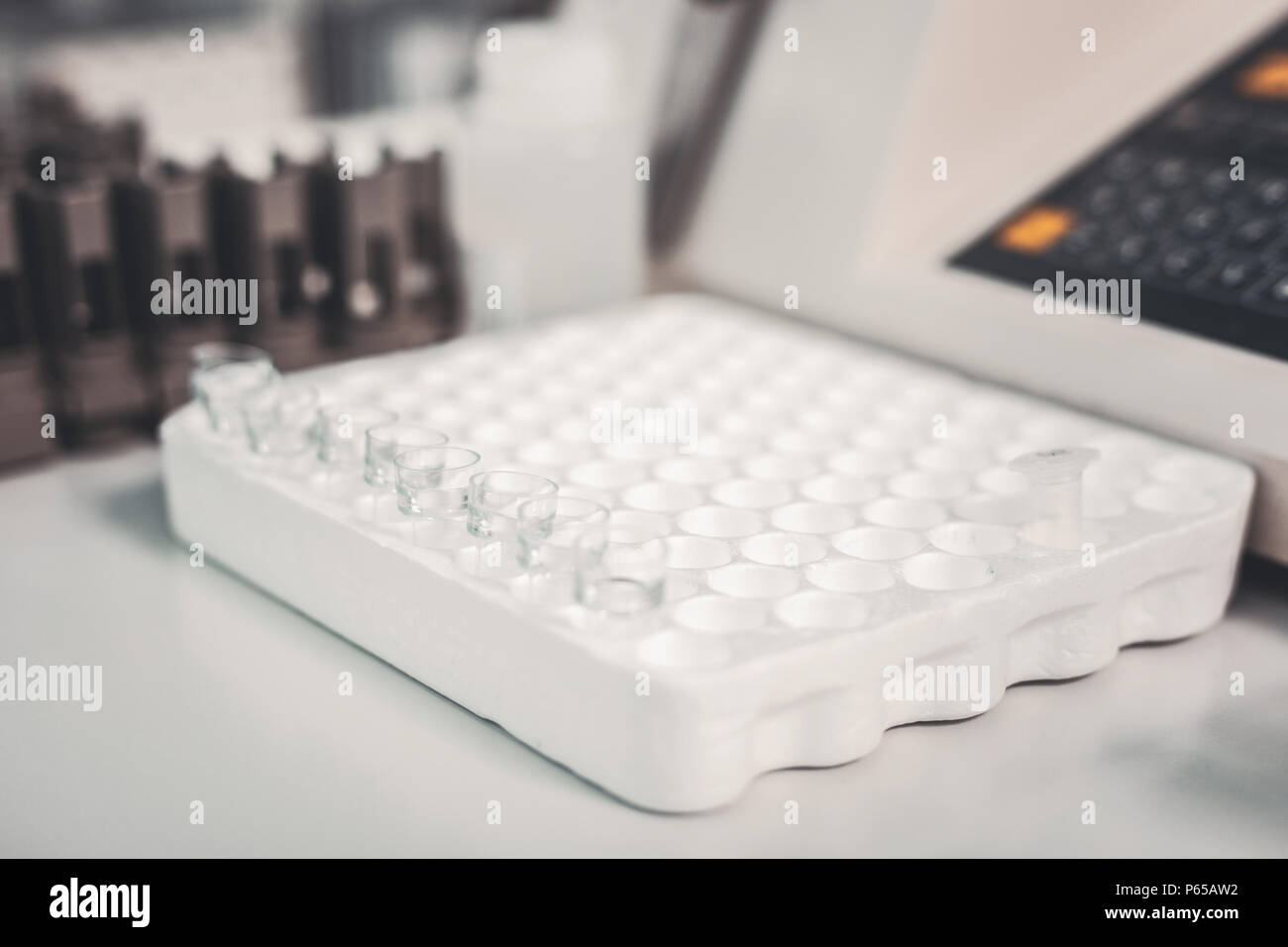 Set of medical tubes on laboratory table Stock Photo - Alamy