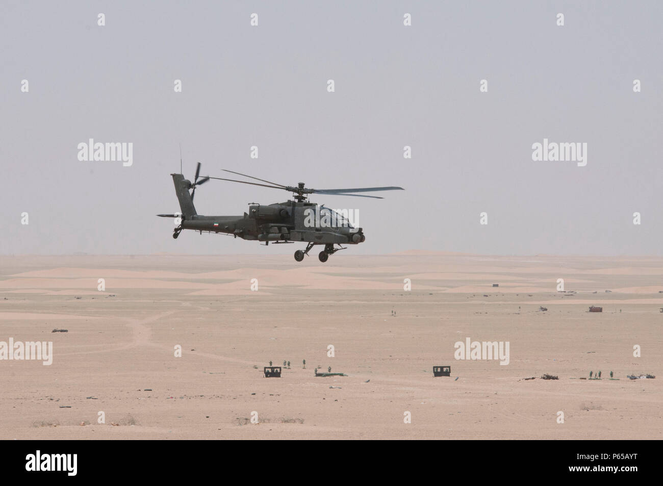 A Kuwait Air Force AH-64 Apache helicopter returns to its battle ...
