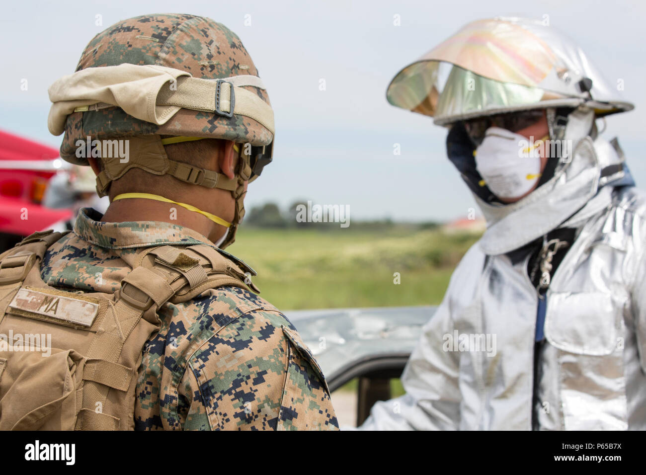 U.S. Marine Corps Lance Cpl. Edward L. Ma, (left), a rifleman with ...
