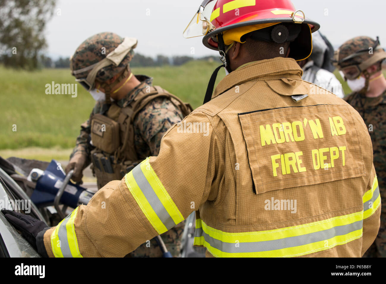 Hugo Frias, (right), a Spanish firefighter with Morón Fire Department ...