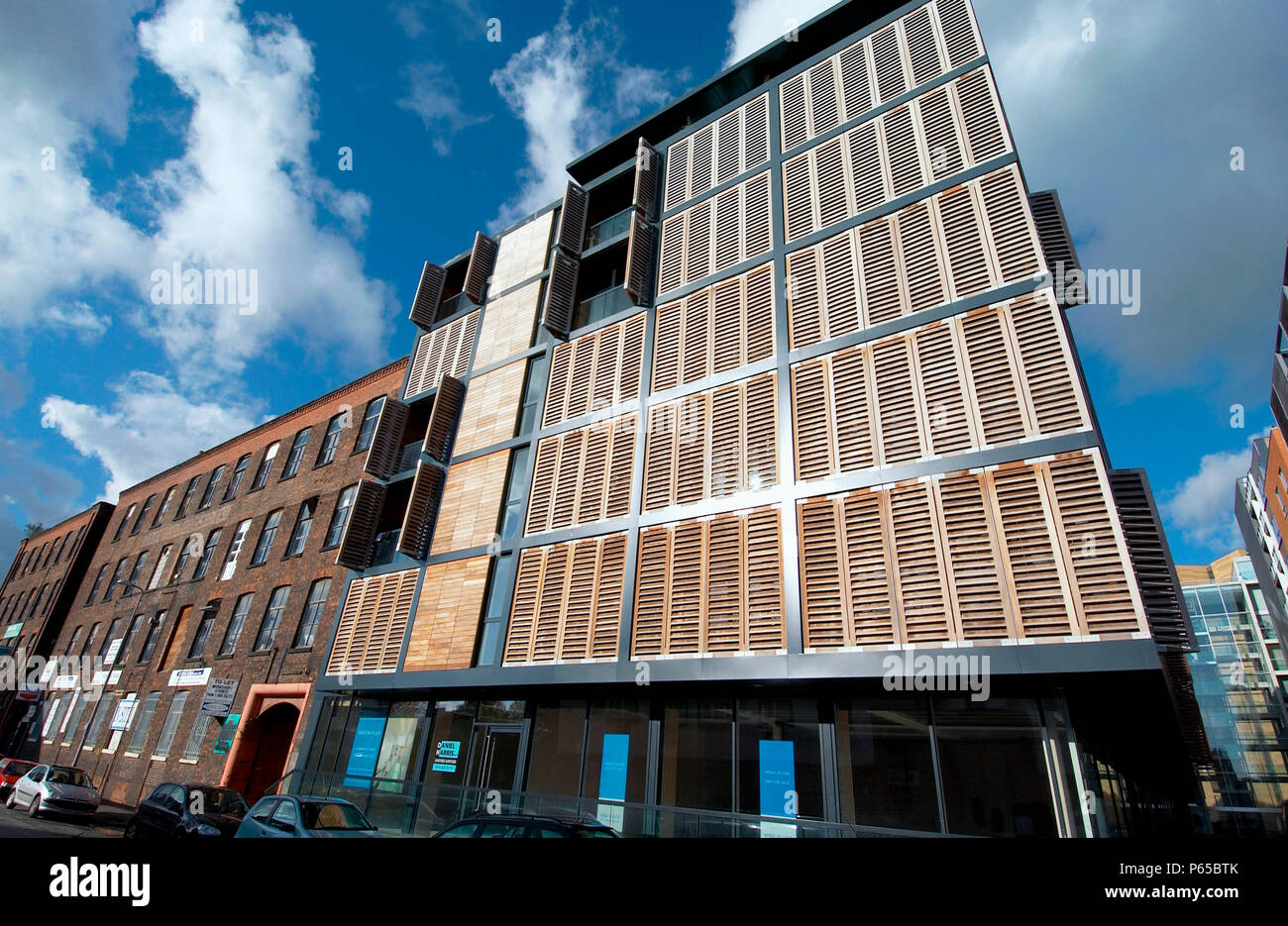 Residential development with wood shutters and timber cladding ...