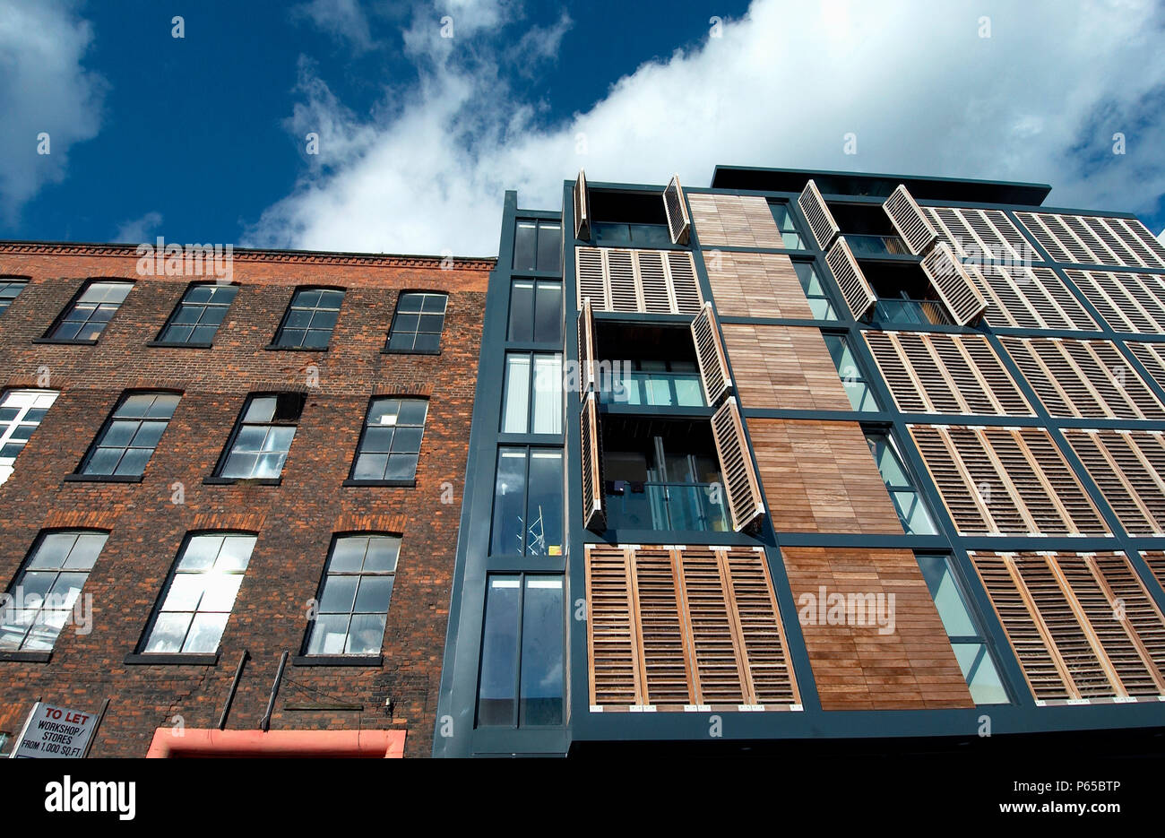 Residential development with wood shutters and timber cladding ...