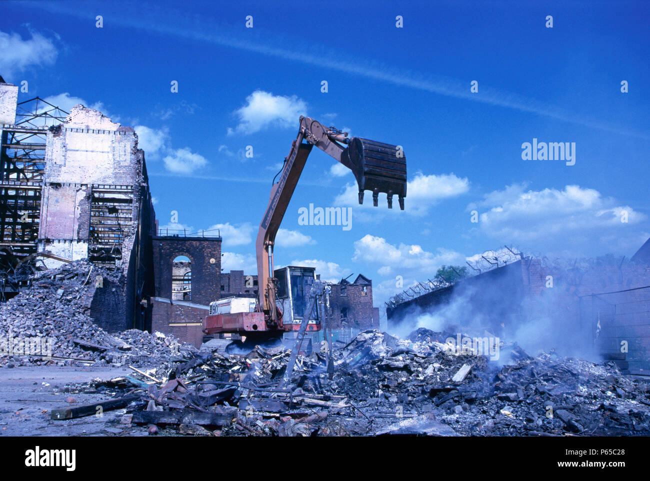 Demolition work in progress Stock Photo - Alamy
