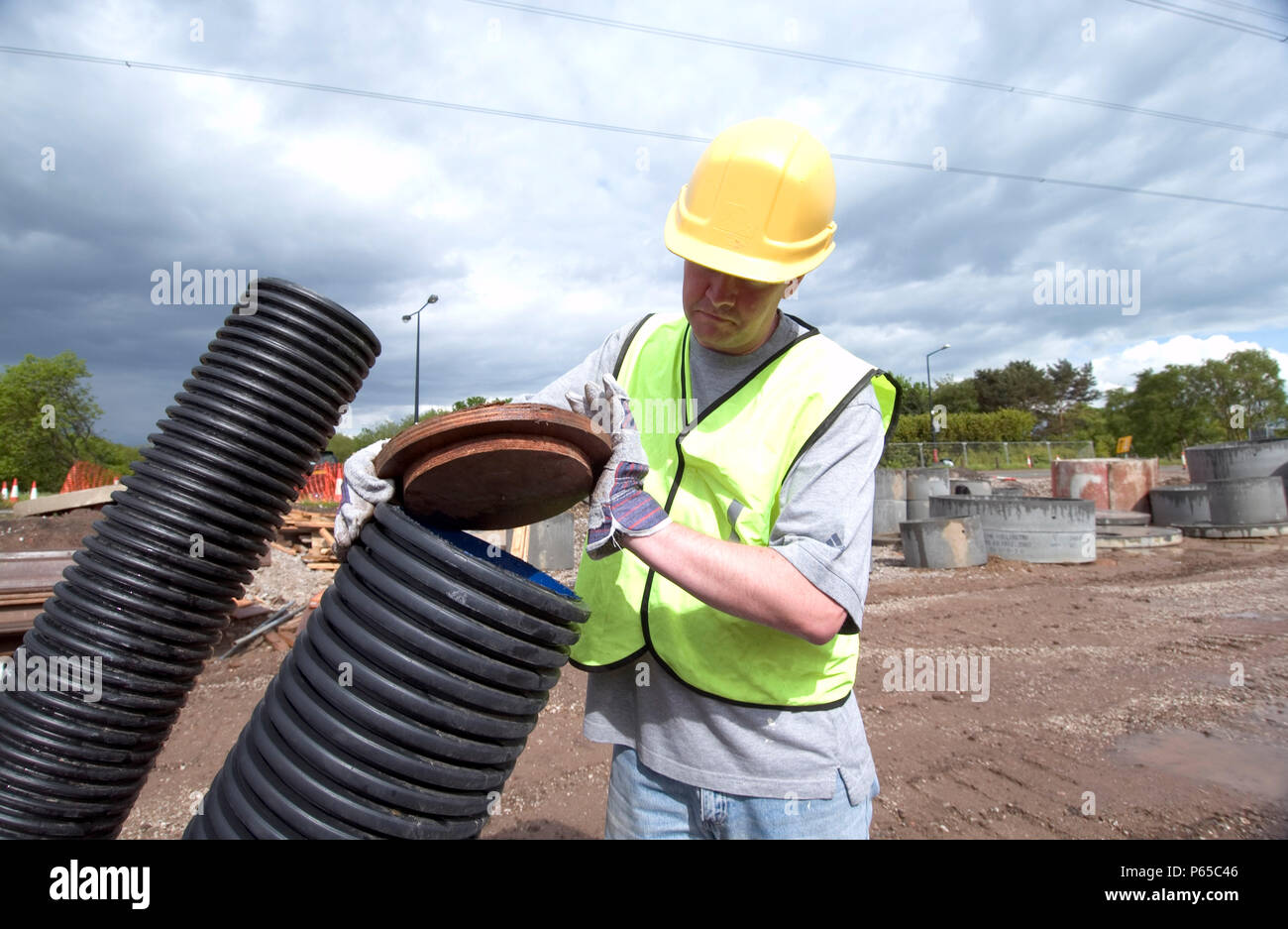 Foreman inspecting pipework Stock Photo - Alamy