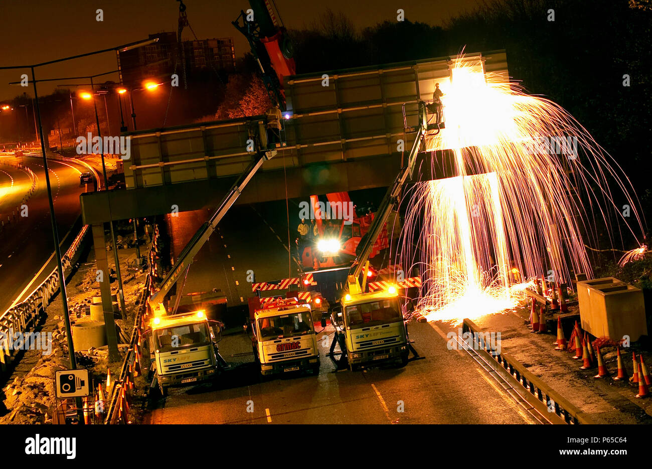 Motorway management. Demolition of a road sign at night. UK Stock Photo ...