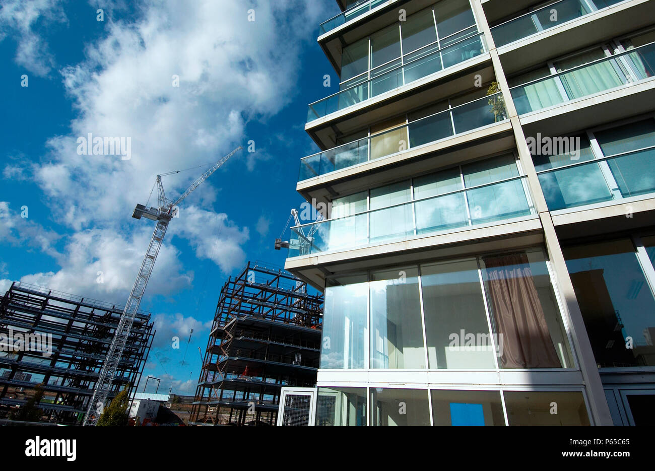 New residential building with construction site in background Stock ...