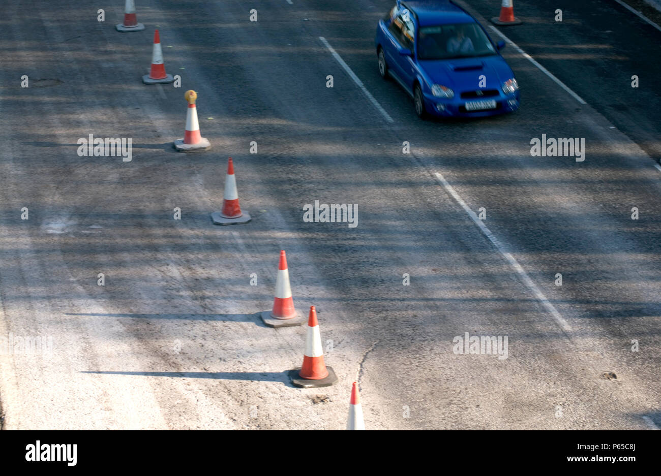 Red cones on a motorway Stock Photo - Alamy