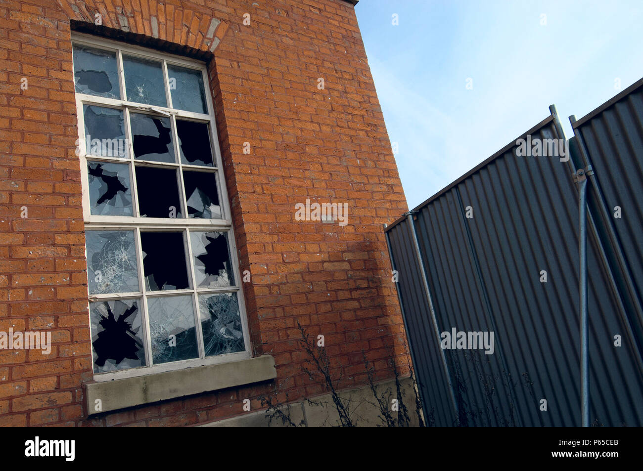Empty house with damaged windows England, UK Stock Photo - Alamy