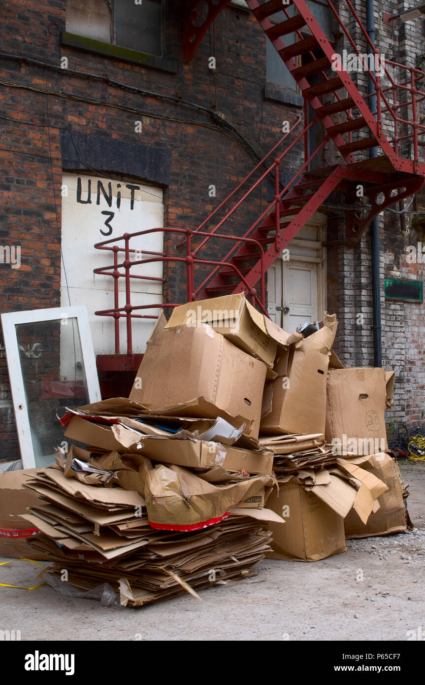 Cardboard pile in a backyard Stock Photo - Alamy