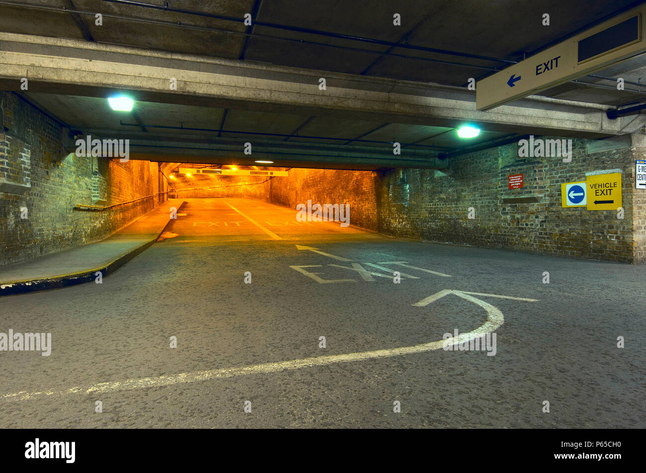 Exit sign in underground car park Stock Photo - Alamy
