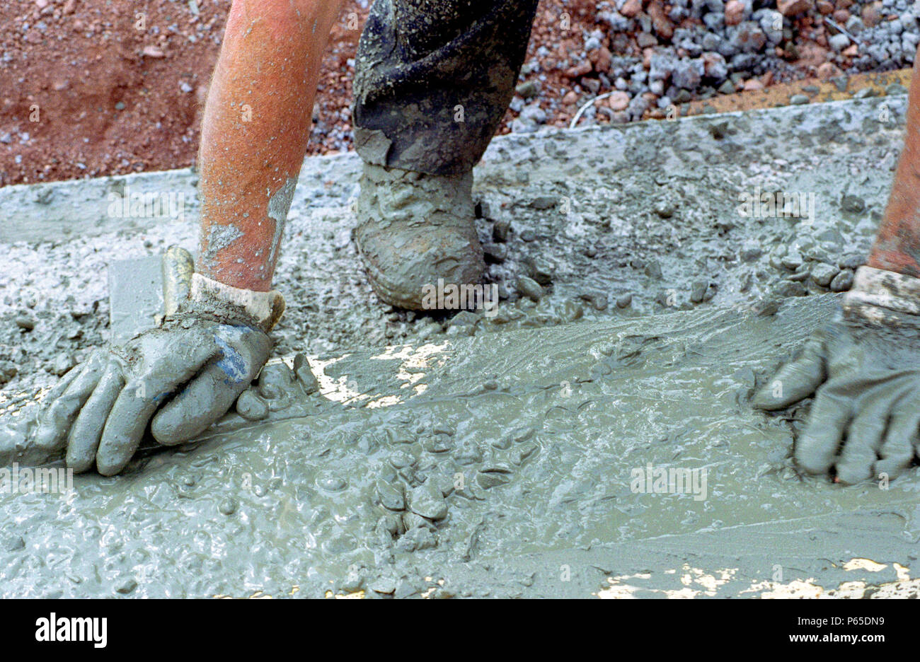 Detail of hand leveling concrete Stock Photo - Alamy