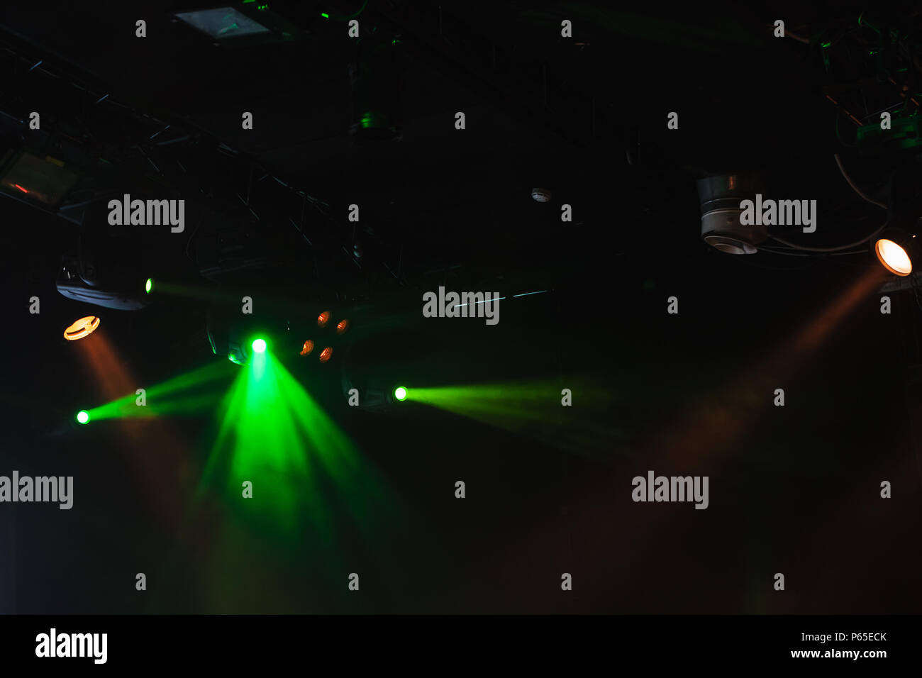 Green scenic lights, beams over dark background, modern stage ...