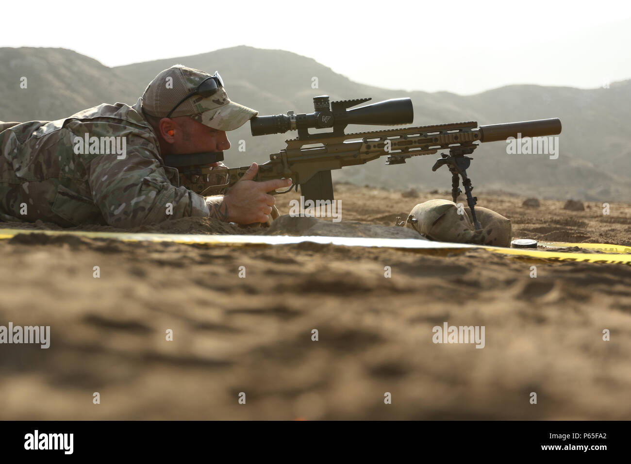 A U.S. competitor takes aim during a sniper field shoot May 3, 2016 as ...