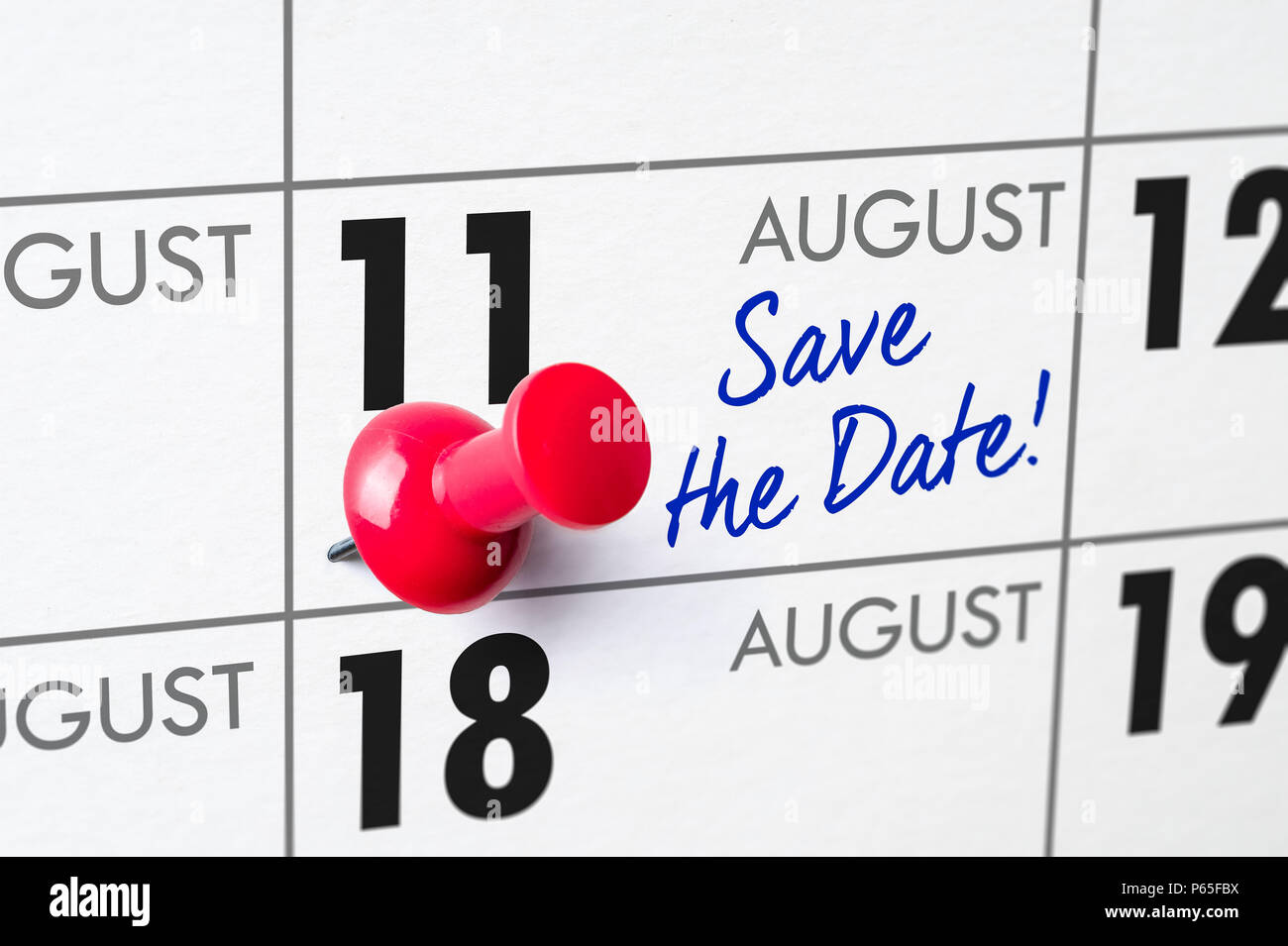 Wall calendar with a red pin - August 11 Stock Photo - Alamy