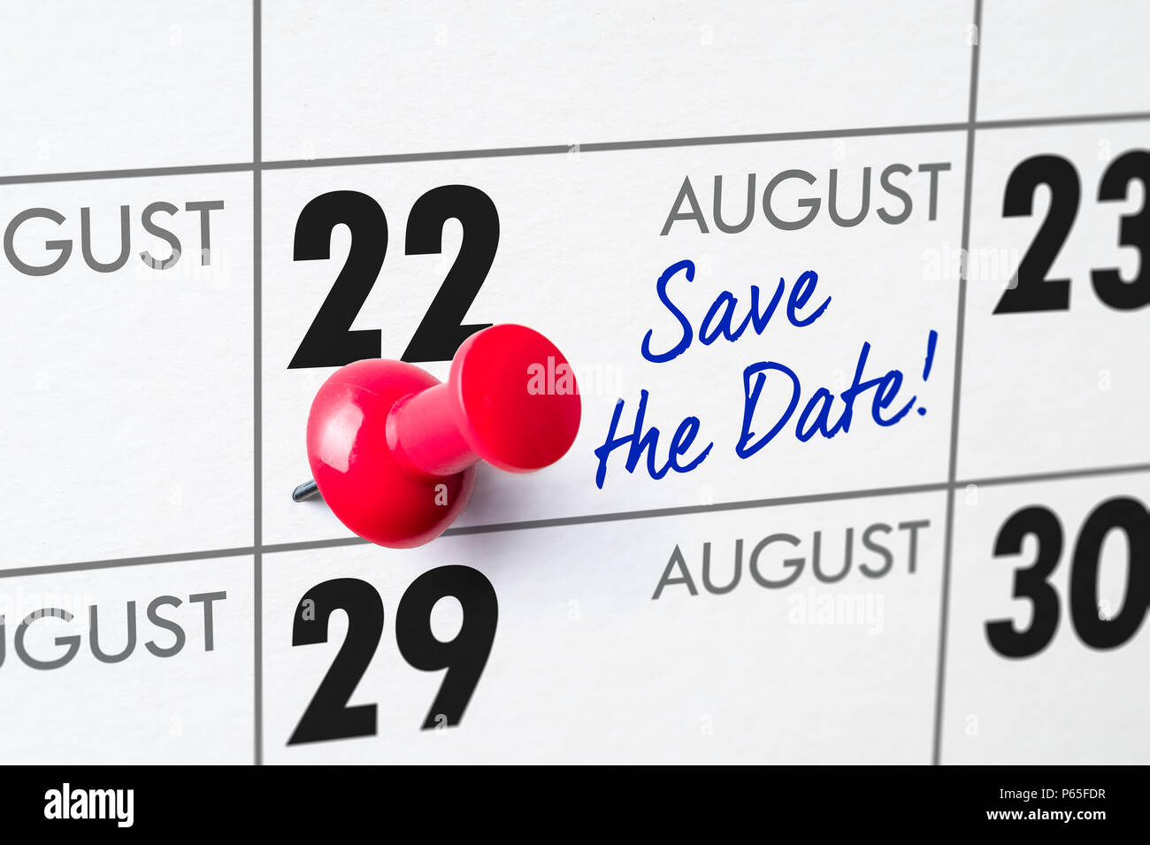 Wall calendar with a red pin - August 22 Stock Photo - Alamy