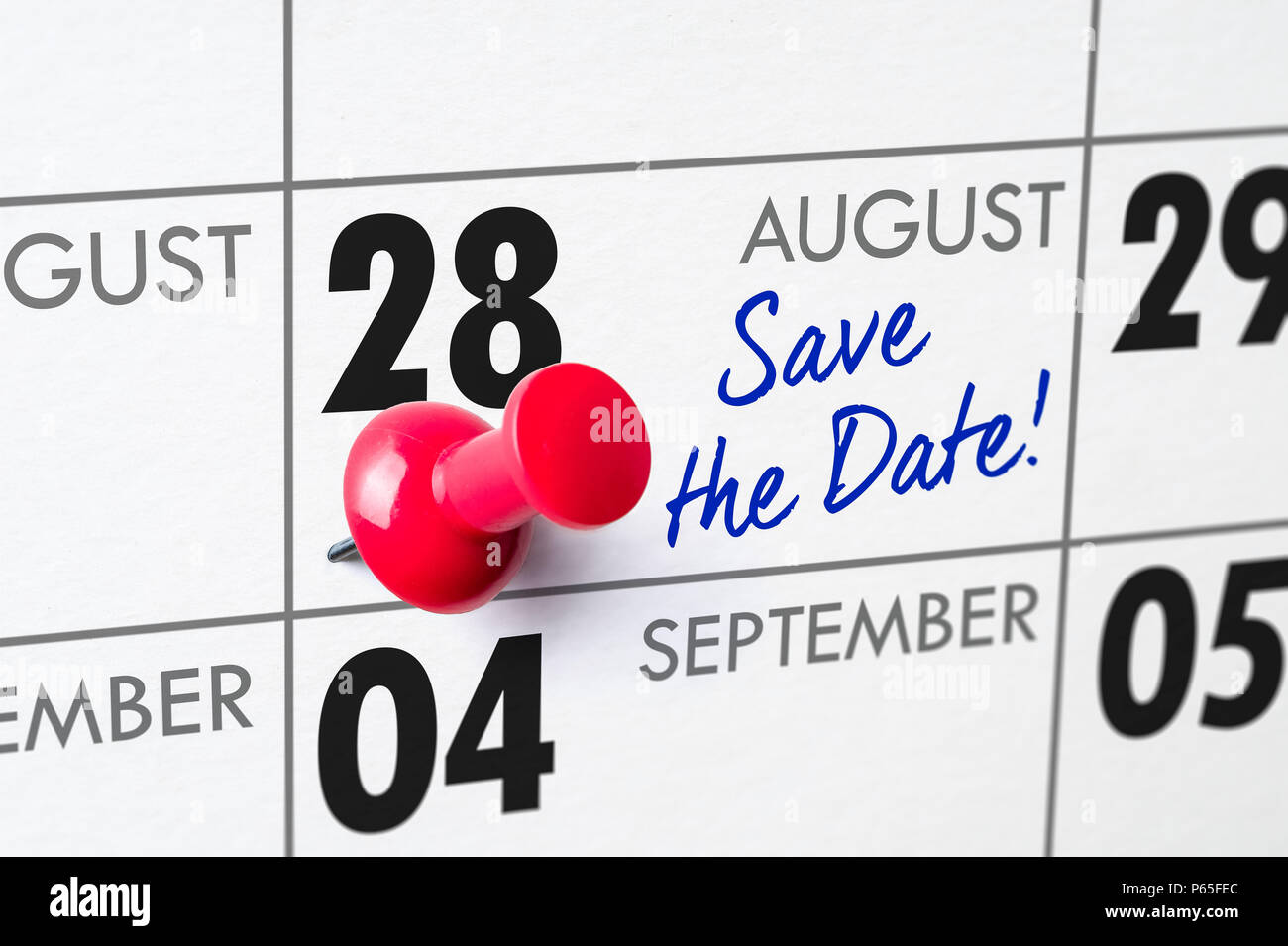 Wall calendar with a red pin - August 28 Stock Photo - Alamy