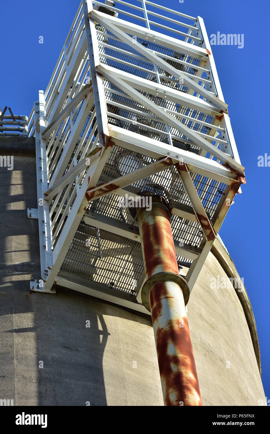 Metal pipes and protective cages on concrete industrial silo Stock ...