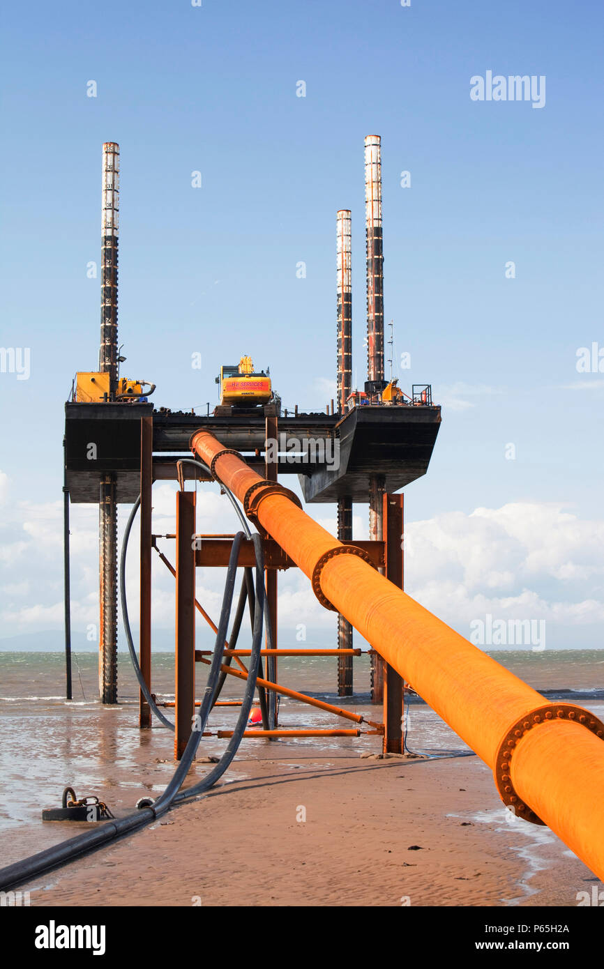 A jack up barge working on the foreshore of the Solway Firth near ...
