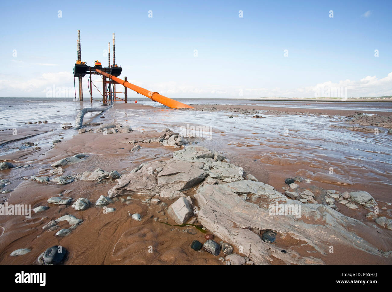 A jack up barge working on the foreshore of the Solway Firth near ...