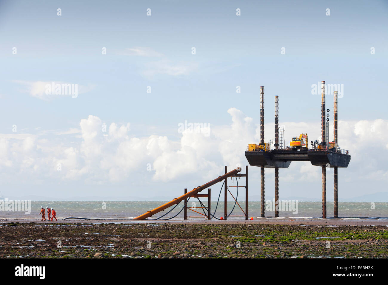 A jack up barge working on the foreshore of the Solway Firth near ...
