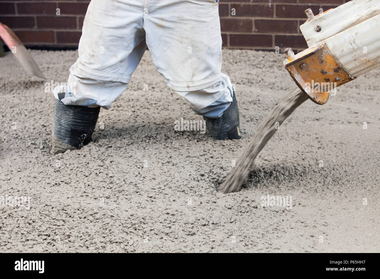 Pouring concrete for the floor of a house extension, Ambleside, UK ...
