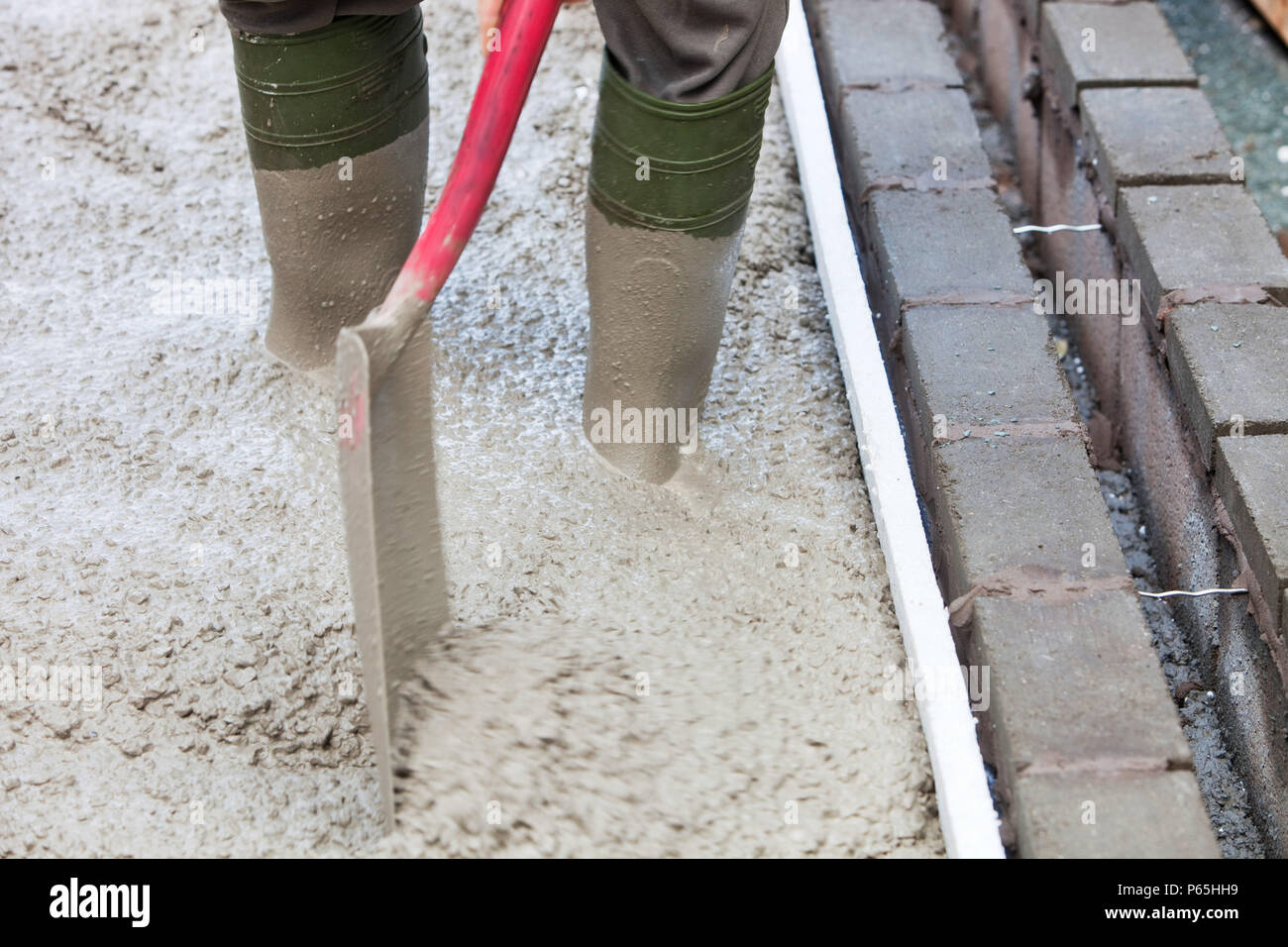 Pouring concrete for the floor of a house extension, Ambleside, UK ...