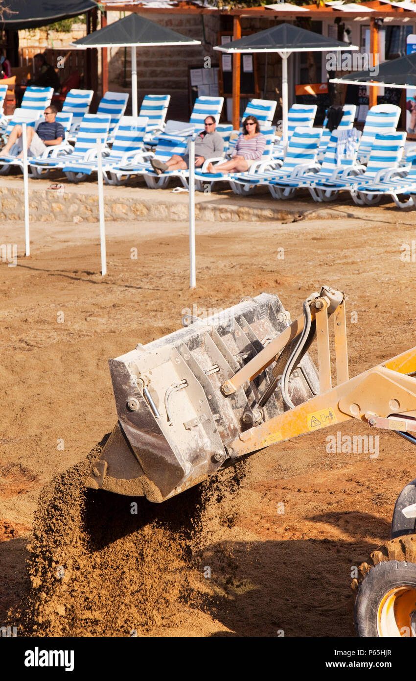 Repairing storm damage to a beach in Teos, Western Turkey by adding new ...