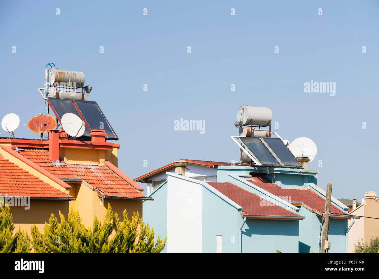 Solar water heaters on house roofs in Teos, Turkey Stock Photo - Alamy