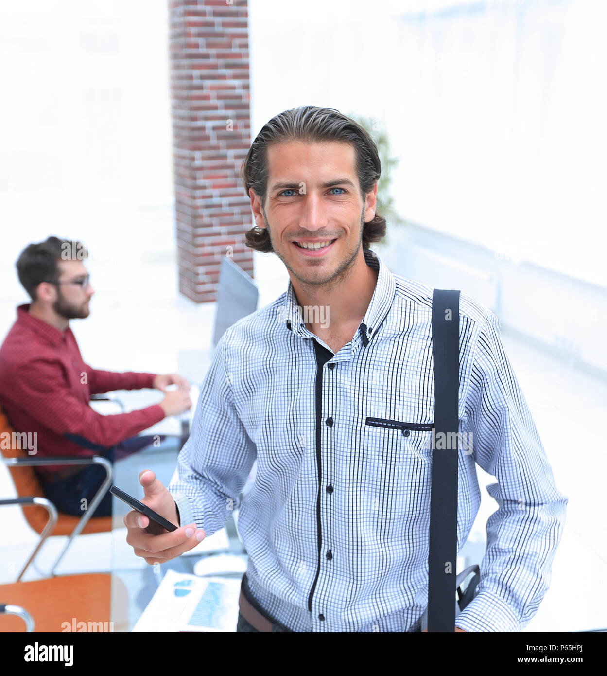 employee reads a text message on smartphone Stock Photo - Alamy