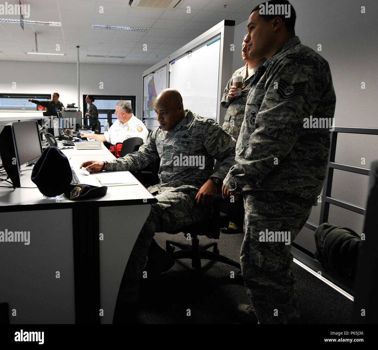 Personnel from the 86th Security Forces Squadron review a checklist in ...