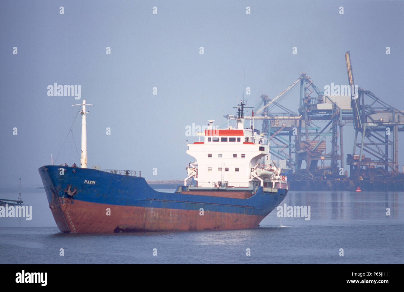 Ship pulling into harbor Stock Photo - Alamy