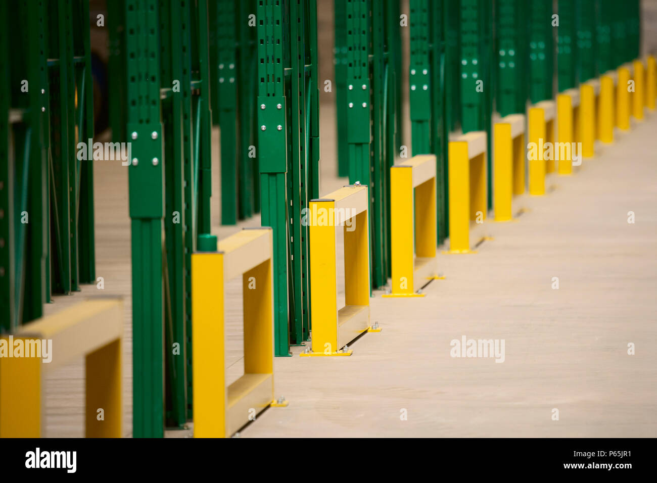 Empty warehouse with shelving and racks Stock Photo - Alamy